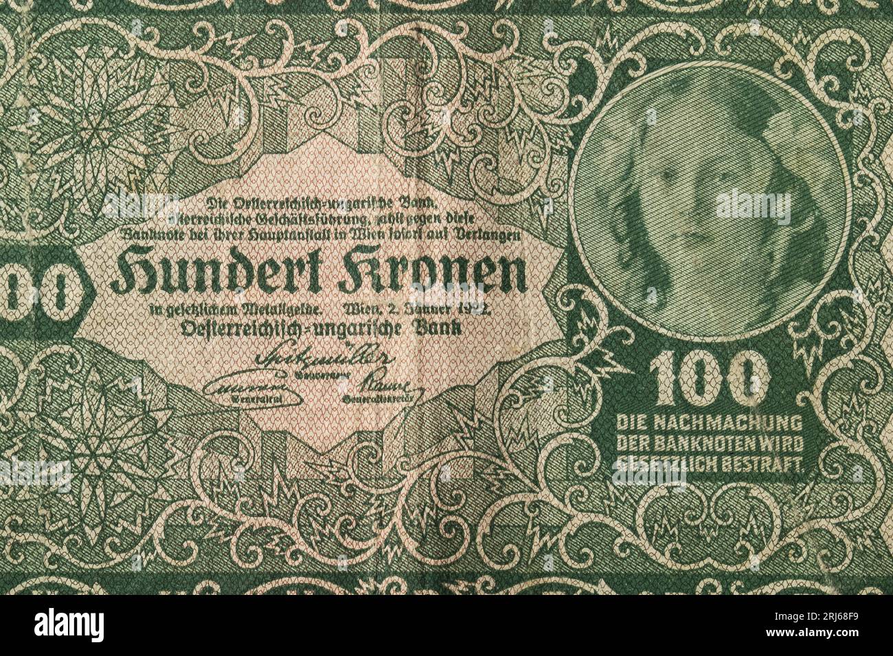 A closeup of a 100 Krone banknote from Austria-Hungary, displaying the ...