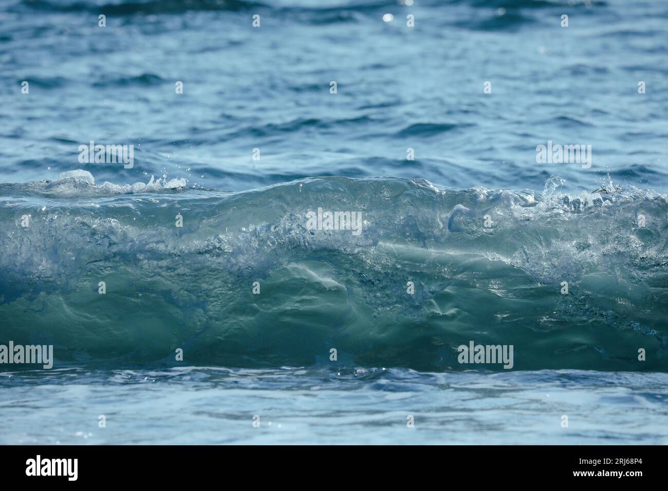 A serene and tranquil view of a body of water with gentle waves rolling ...