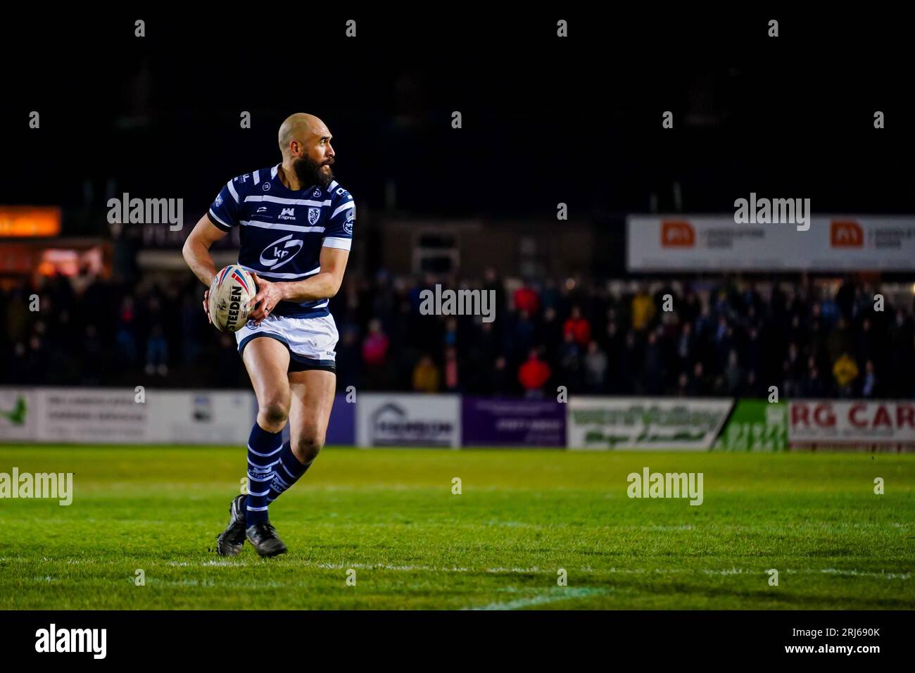 A young adult male athlete running across a football field: Jonathan ...