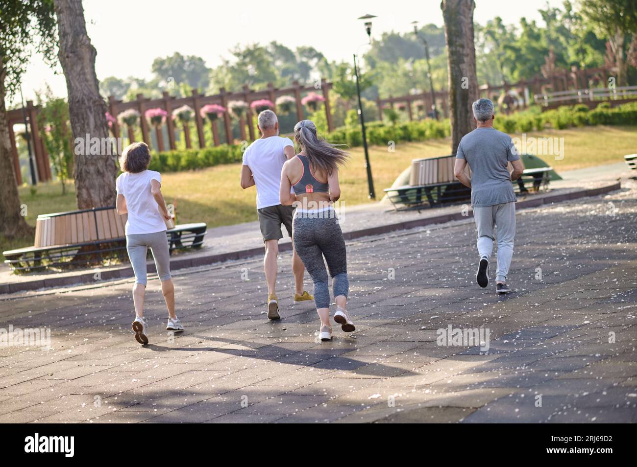 People jogging in park, enjoying friend time at jogging park while ...