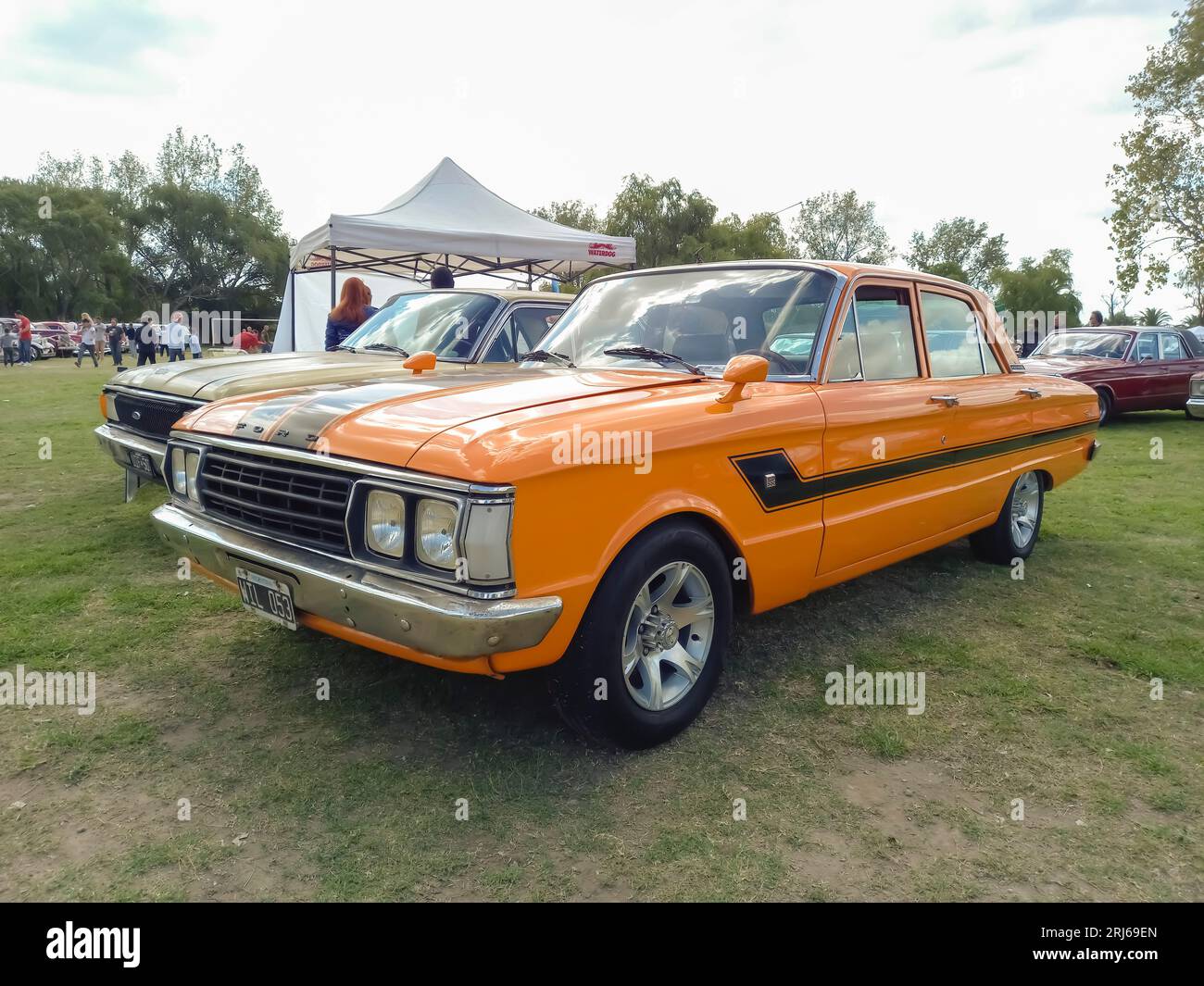 Old orange sporty 1970s Ford Falcon Sprint SP sedan on the lawn ...