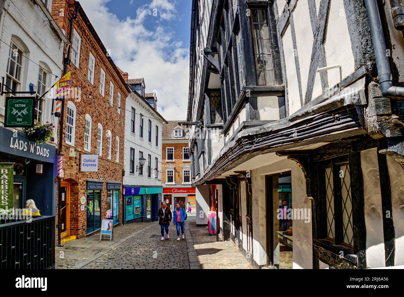 Shrewsbury, Shropshire, England, UK - People walking between shops past ...
