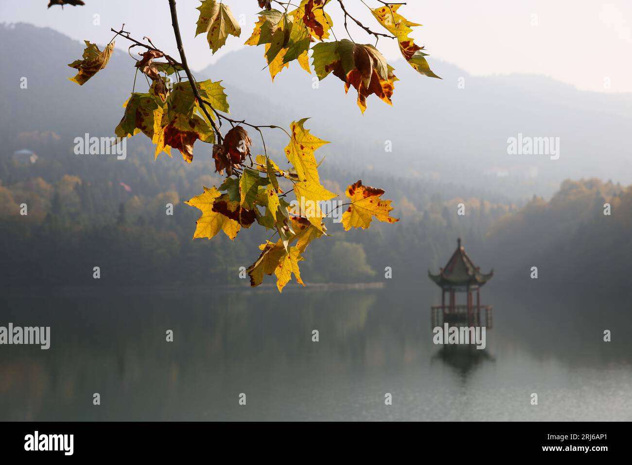 A Chinese-style pavilion floating in the water next to the Lushan ...