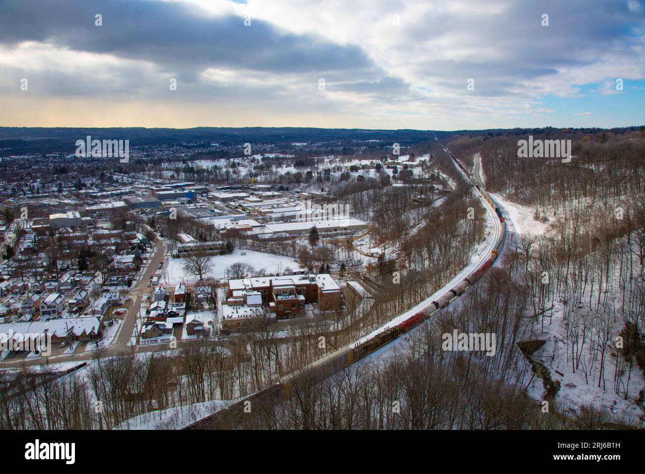 An overhead view of a train chugging through a picturesque winter ...