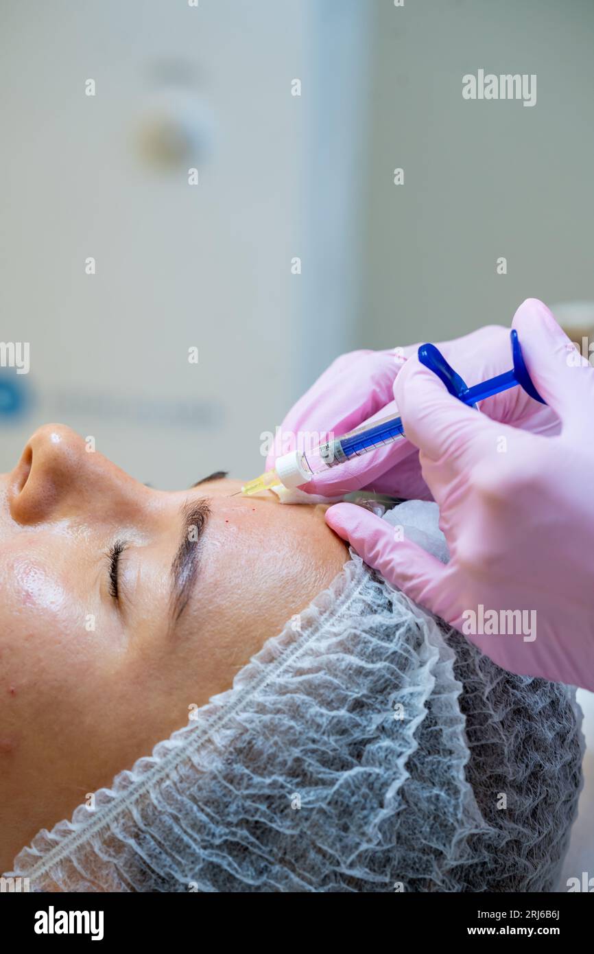 Face injections to woman with skin problems, beauty treatment in ...