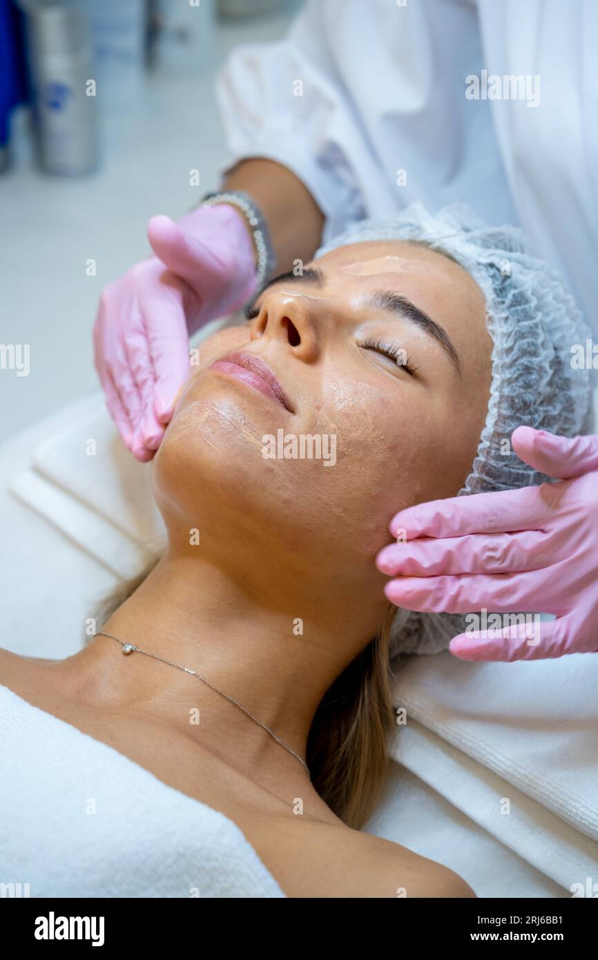 Female face getting microdermabrasion procedure in a beauty spa salon ...