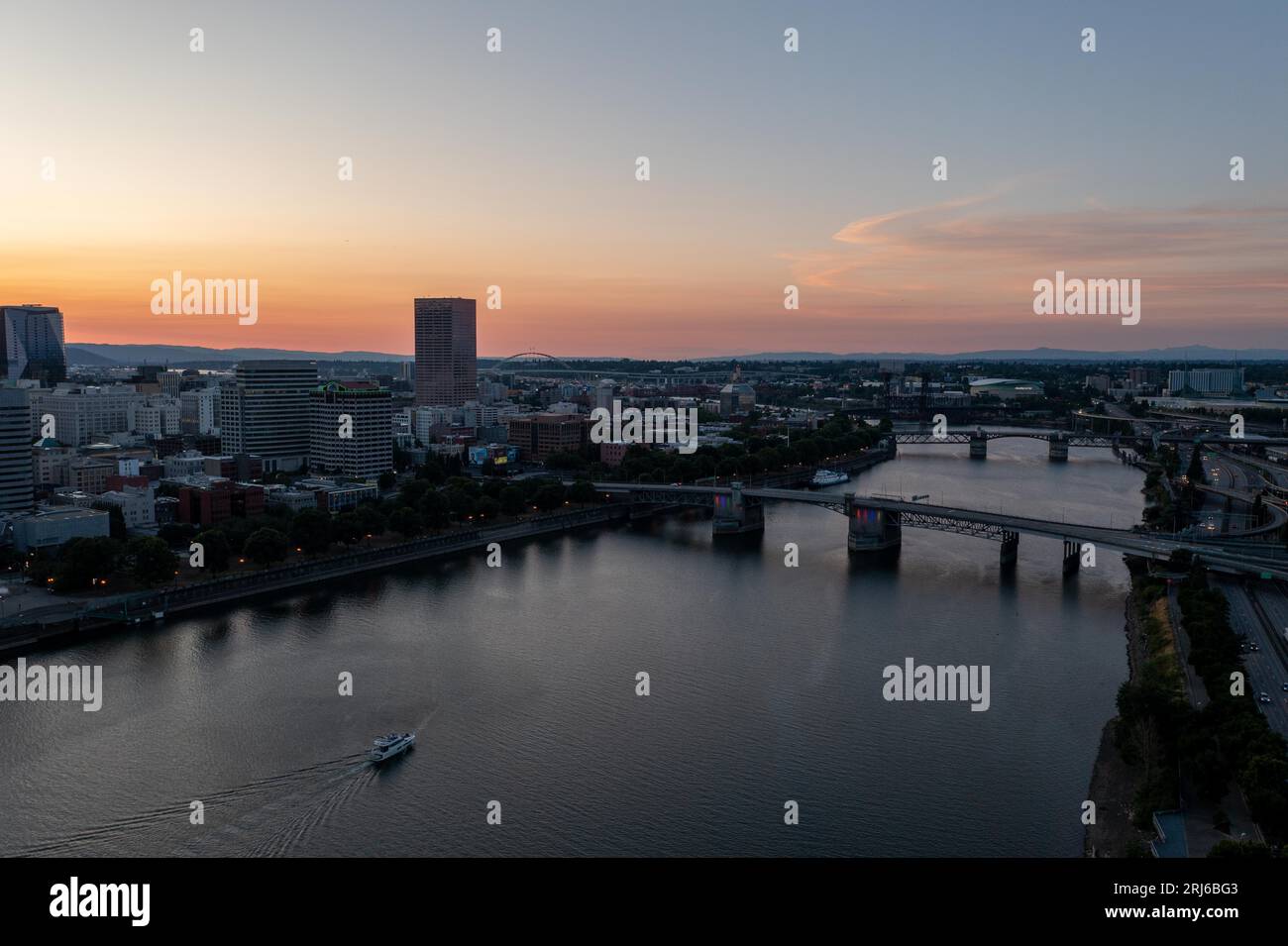 A stunning aerial view of a bustling city skyline at sunset, seen from ...