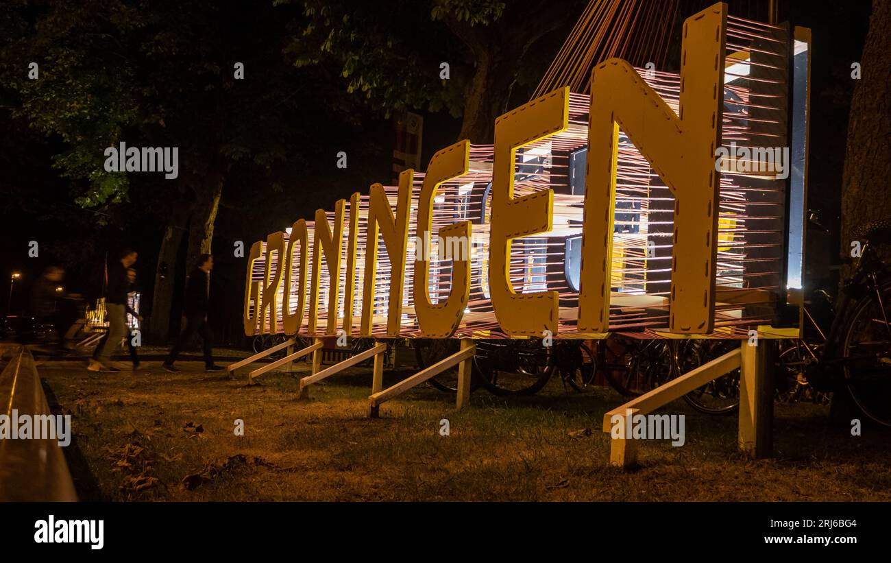 sign in the city center of groningen welcoming new students night time ...