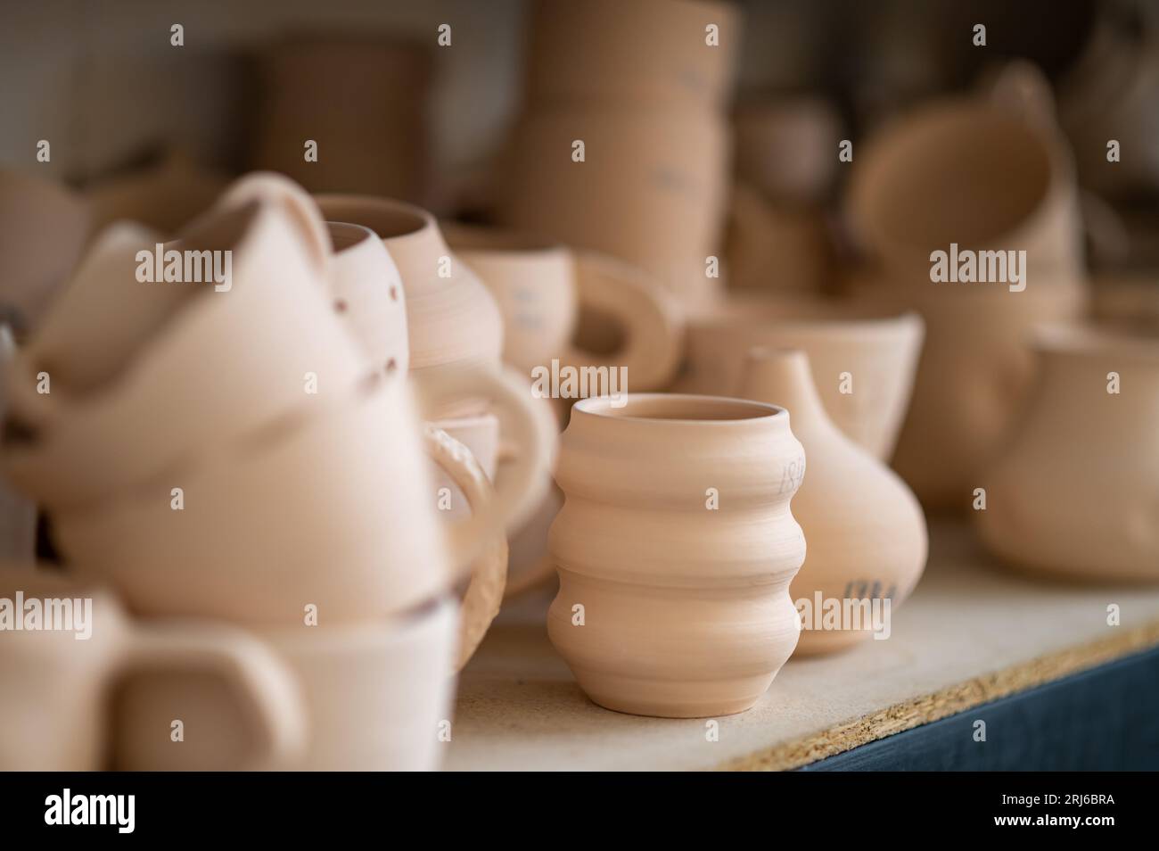 Pottery shelf in studio, creative store clay products, collection and ...
