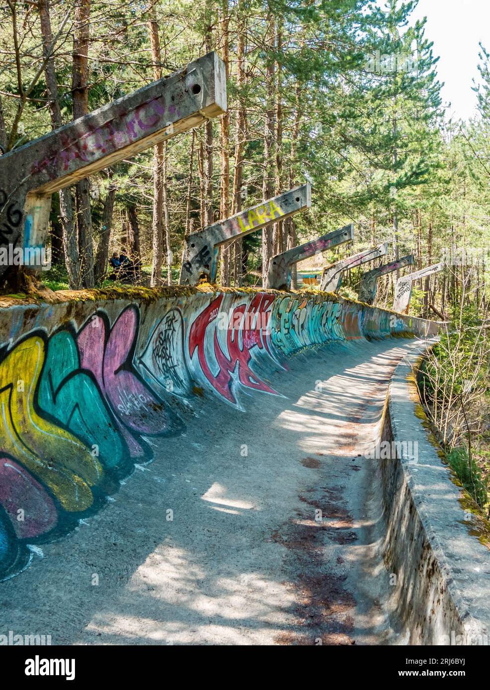 a mini skateboard ramp fully covered with graffiti in the middle of a ...