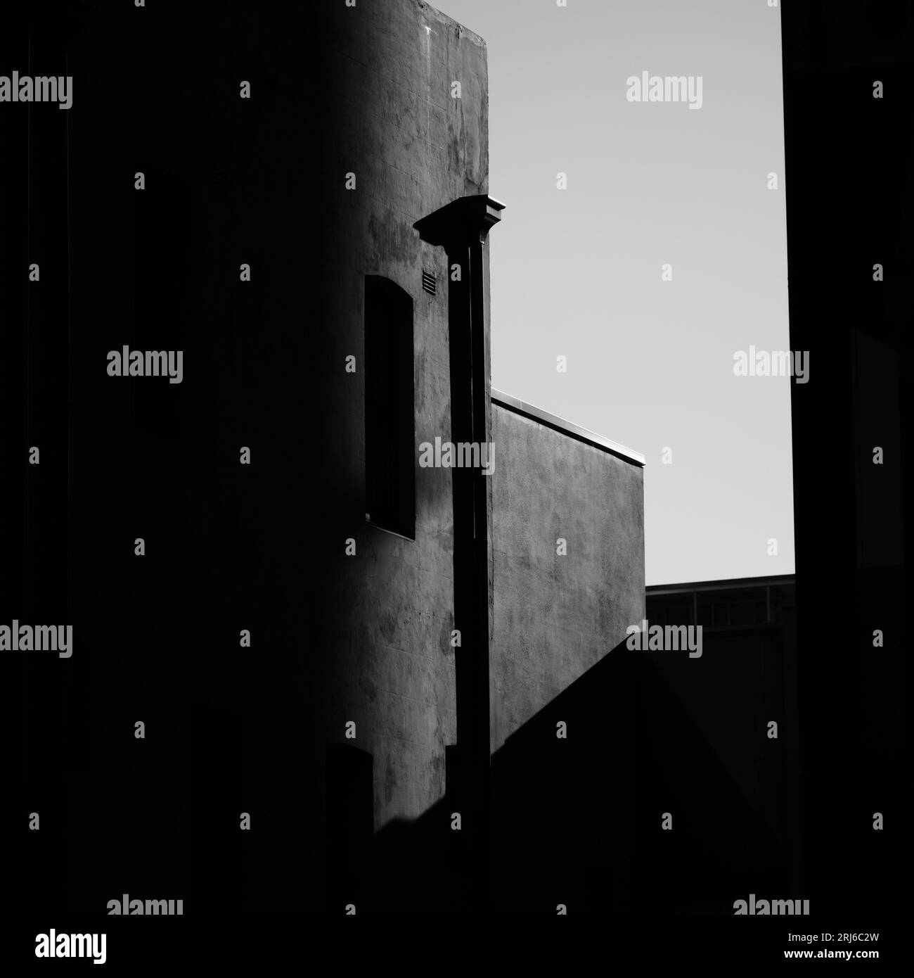 An artistic photograph of a modern building in a grayscale color ...