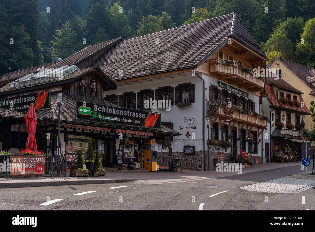 A row of storefronts and small buildings in Triberg im Schwarzwald ...