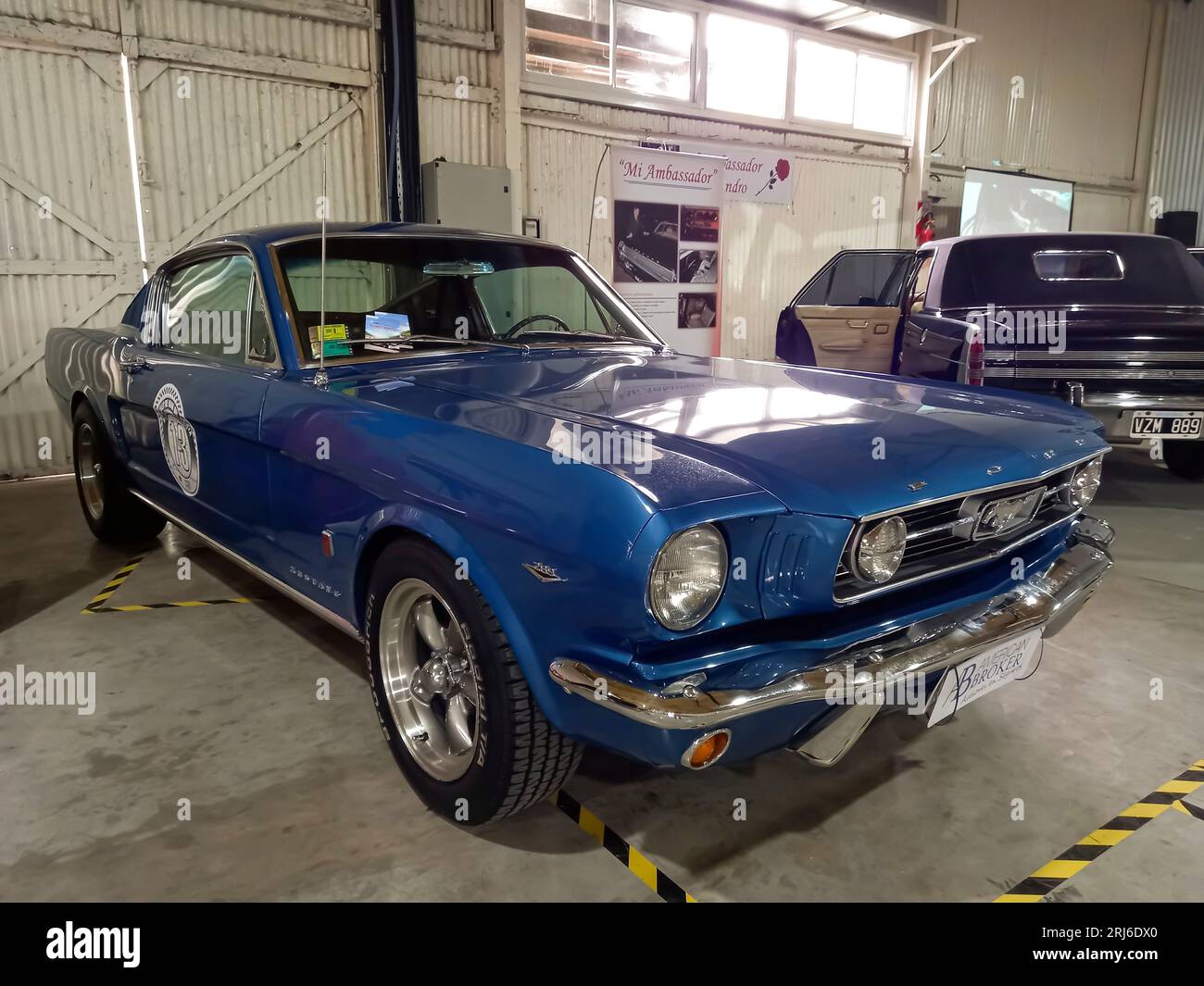 Old blue sport muscle car Ford Mustang V8 coupe 1960s in a garage. Expo ...