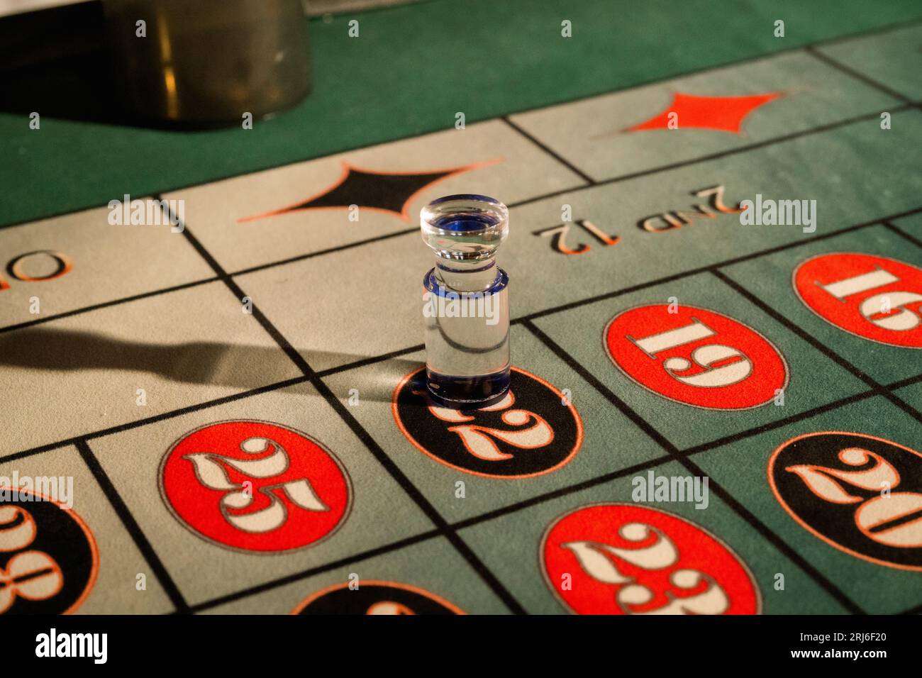 A high-angle close-up shot of a roulette wheel with a chip Stock Photo ...