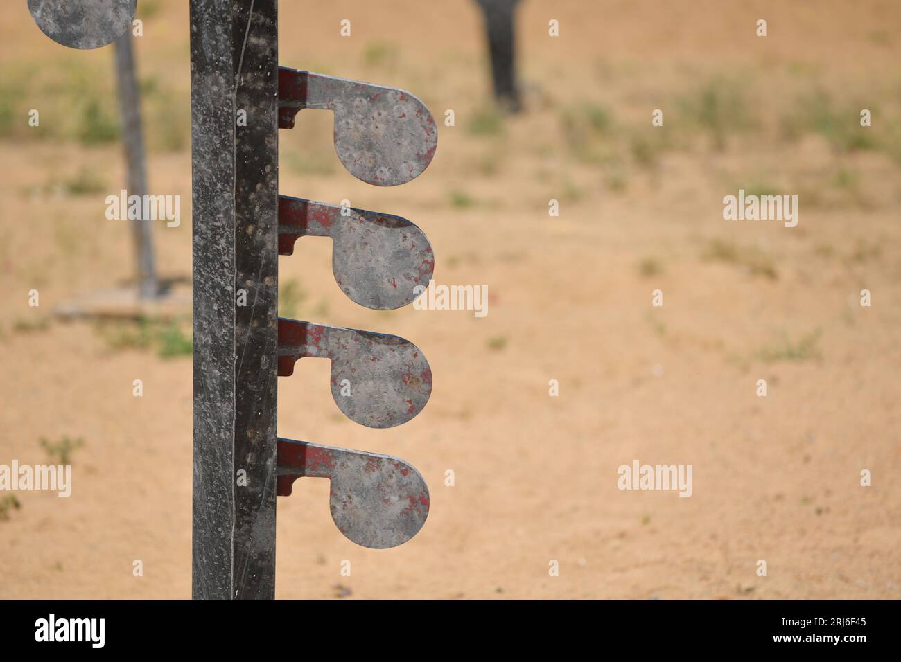 The targets at a shooting range set up in a desolate outdoor area ...