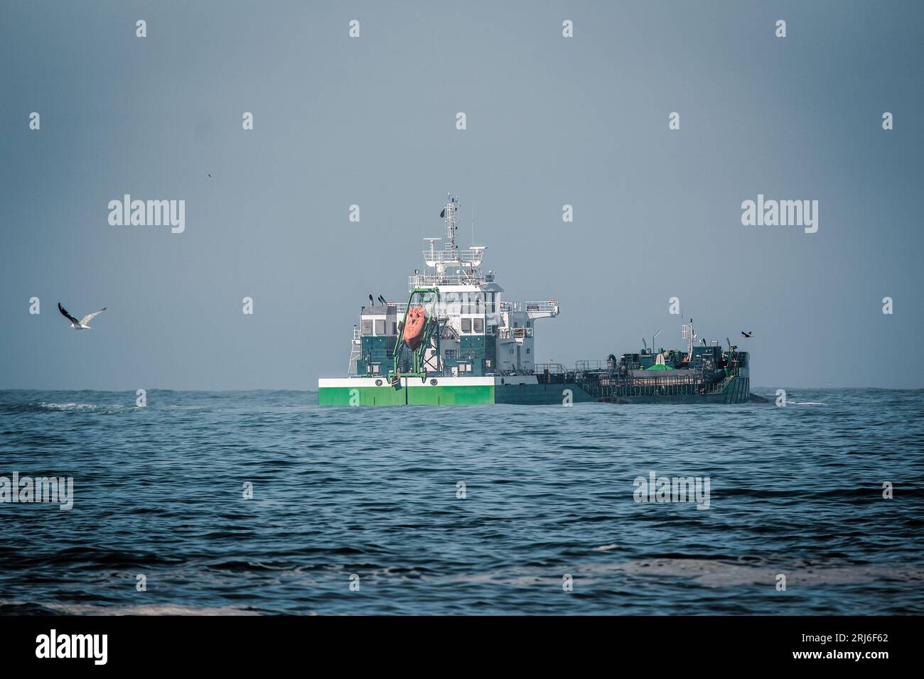 A majestic sailing vessel floating atop a vast and tranquil ocean Stock ...