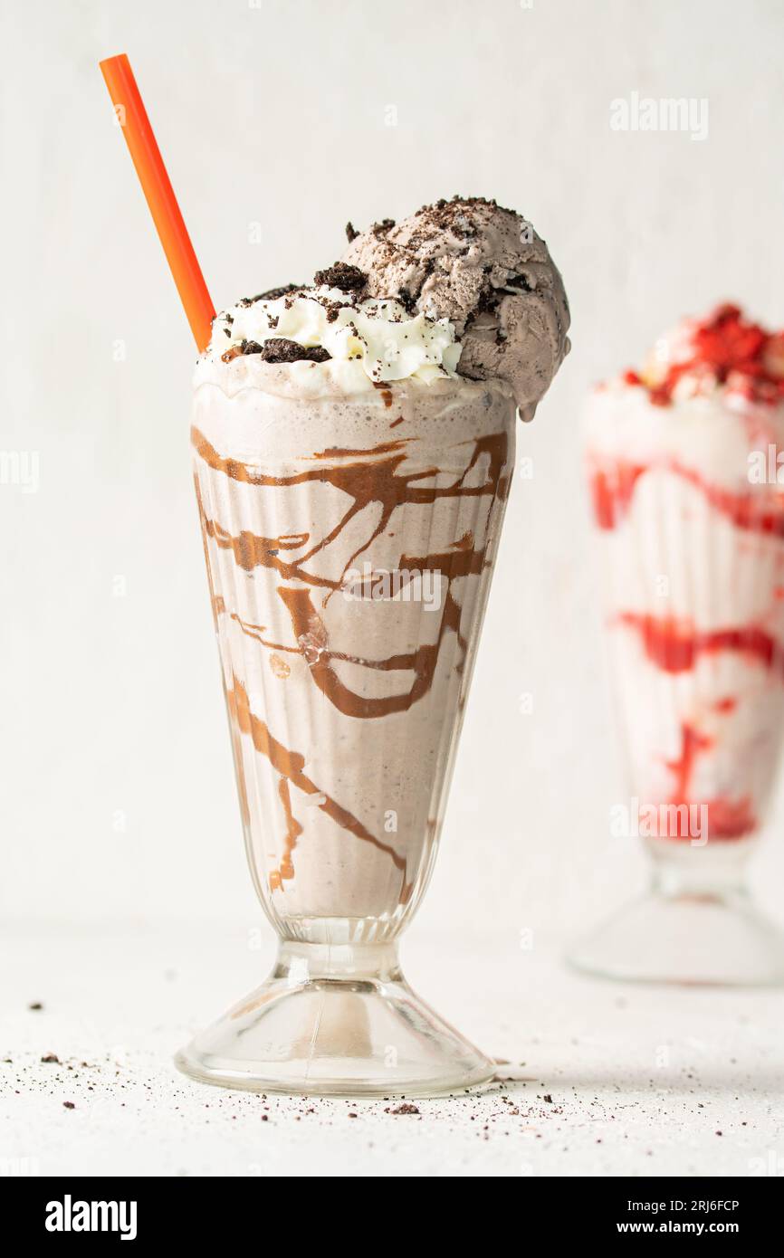 A glass of freshly prepared chocolate milkshake, with chocolate flakes ...