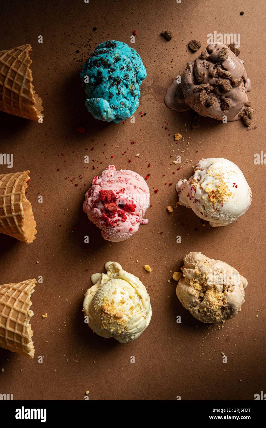 A vibrant and colorful array of ice cream, fresh fruits, and various ...