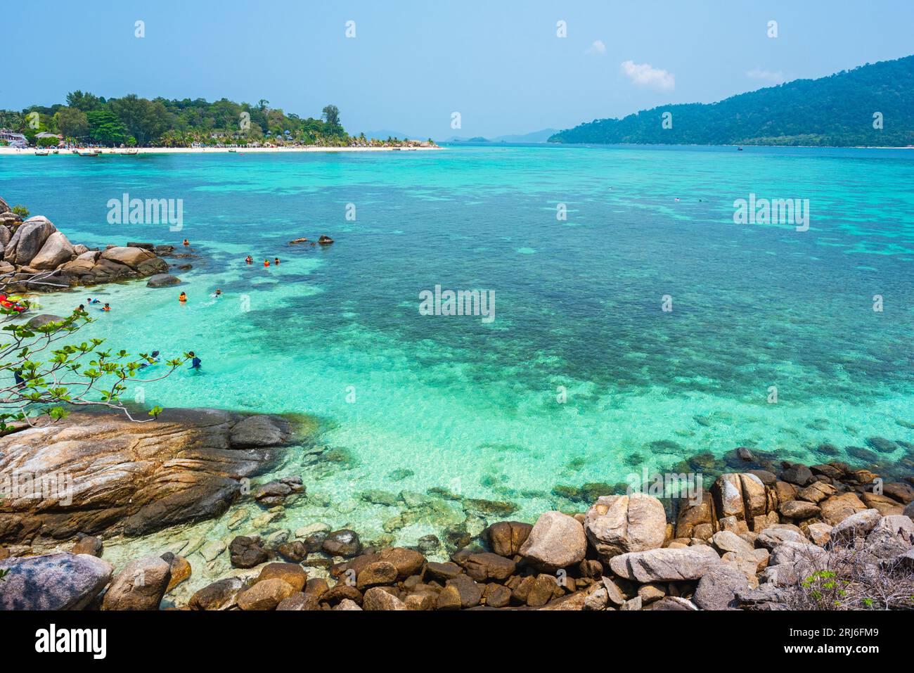 Tiny island Koh Kla with a group of people (unrecognizable) doing ...