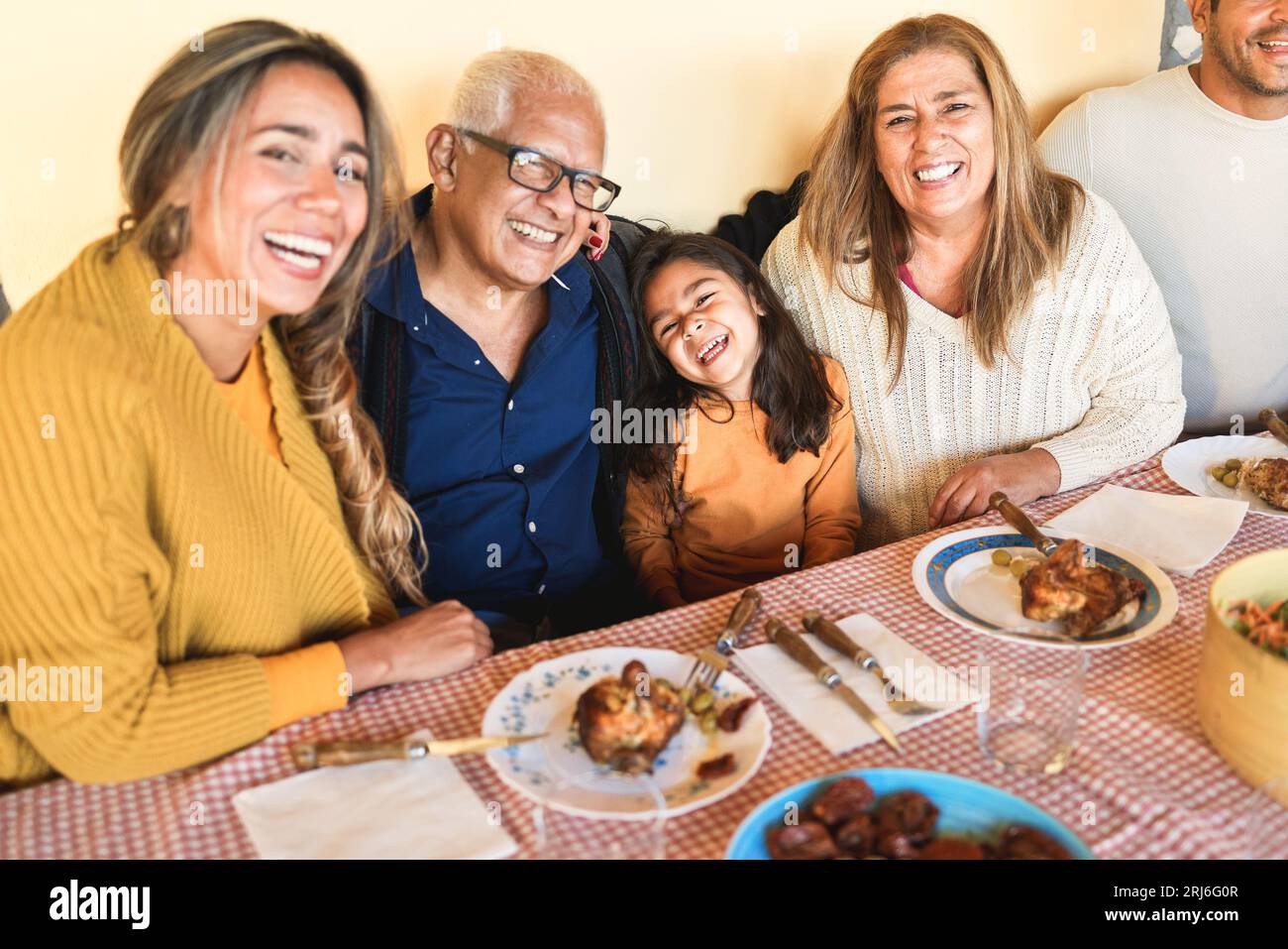 Happy latin mother, daughter, grandfather, grandmother and father ...