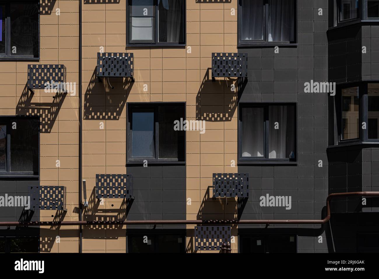 New building facade in housing complex. Modern style in architecture ...