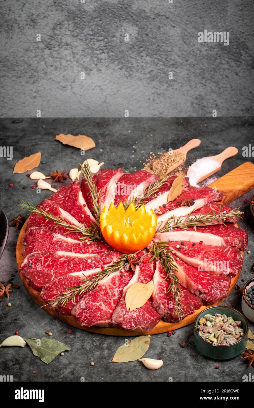 Raw meat ribeye steak entrecote. Raw ribeye on dark background. Butcher ...