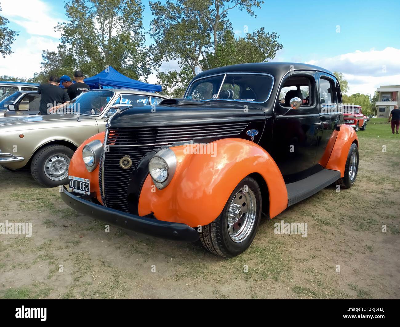 Old black and orange 1938 Ford V8 Standard sedan Fordor hot rod on the ...