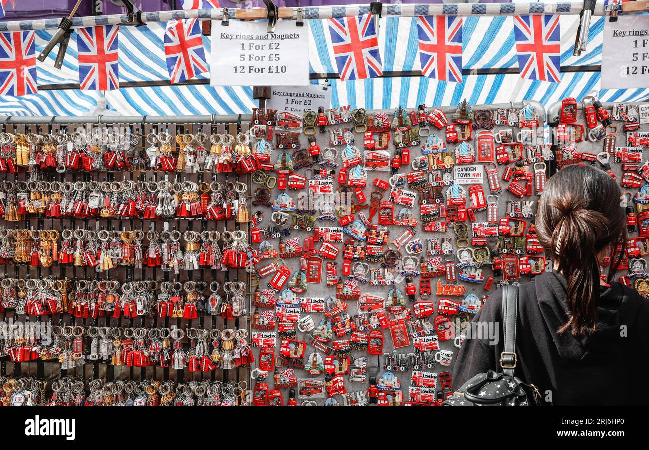 Womank looks at British themed gifts, flags and magnets at a souvenir ...