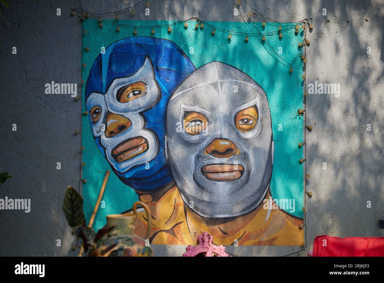 The painting of El Santo and Blue Demon fighters on a wall in Oaxaca ...