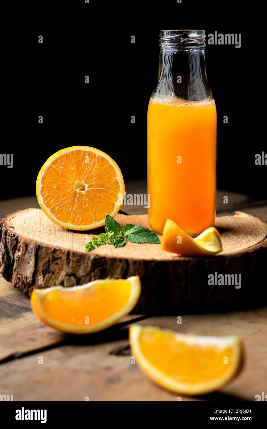 A vertical shot of a bottle of fresh orange juice on the table Stock ...
