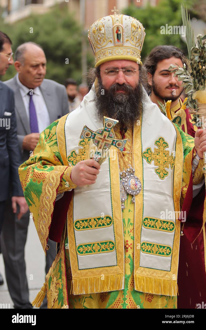 An orthodox priest wearing traditional vestments at a church sanctuary ...