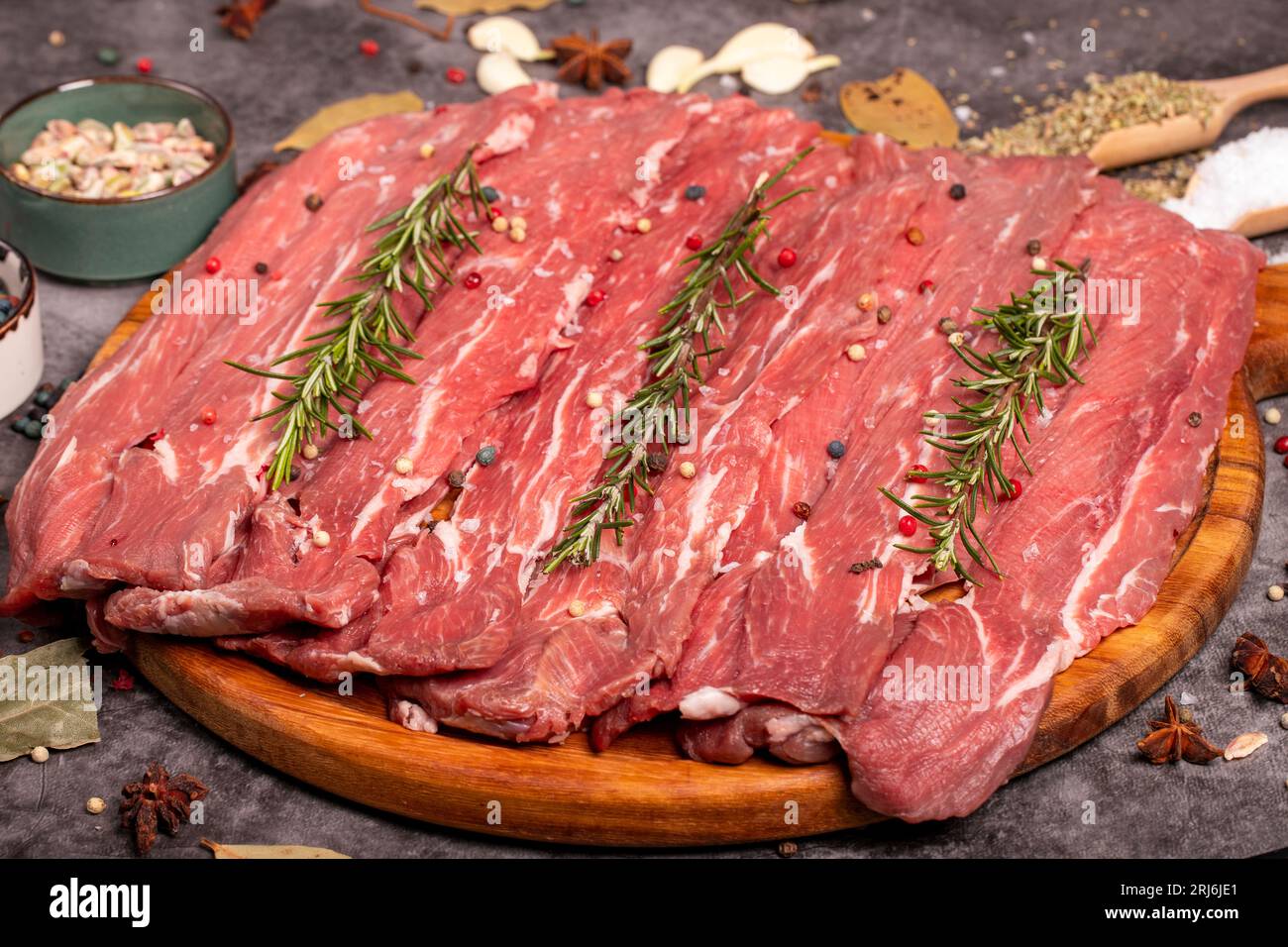 Large piece of beef fillet. Raw fillet meat on dark background. Butcher ...