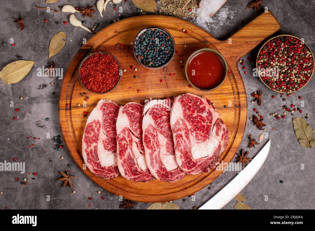 Raw meat ribeye steak entrecote. Raw ribeye on dark background. Butcher ...