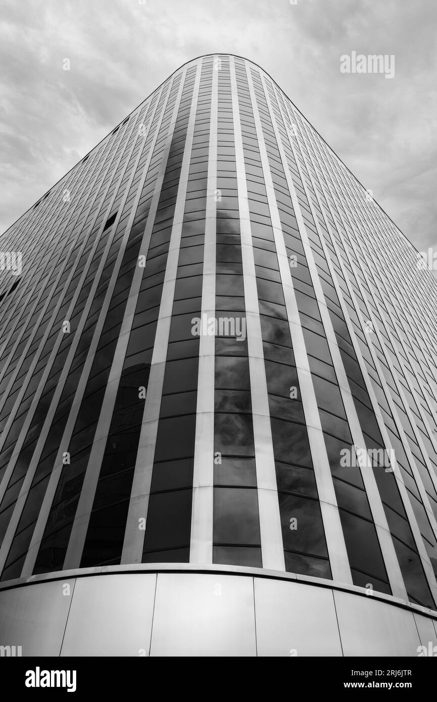 An exterior black and white view of a multi-story building, showcasing ...