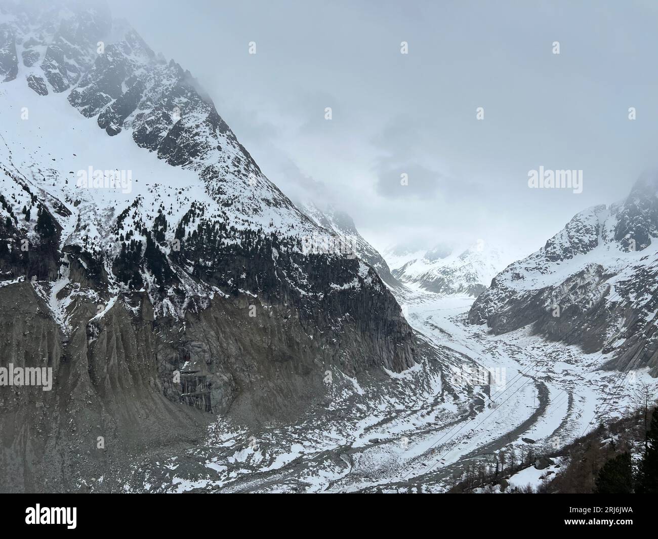 A breathtaking view of the snow-covered French Alps. Mer de Glace ...