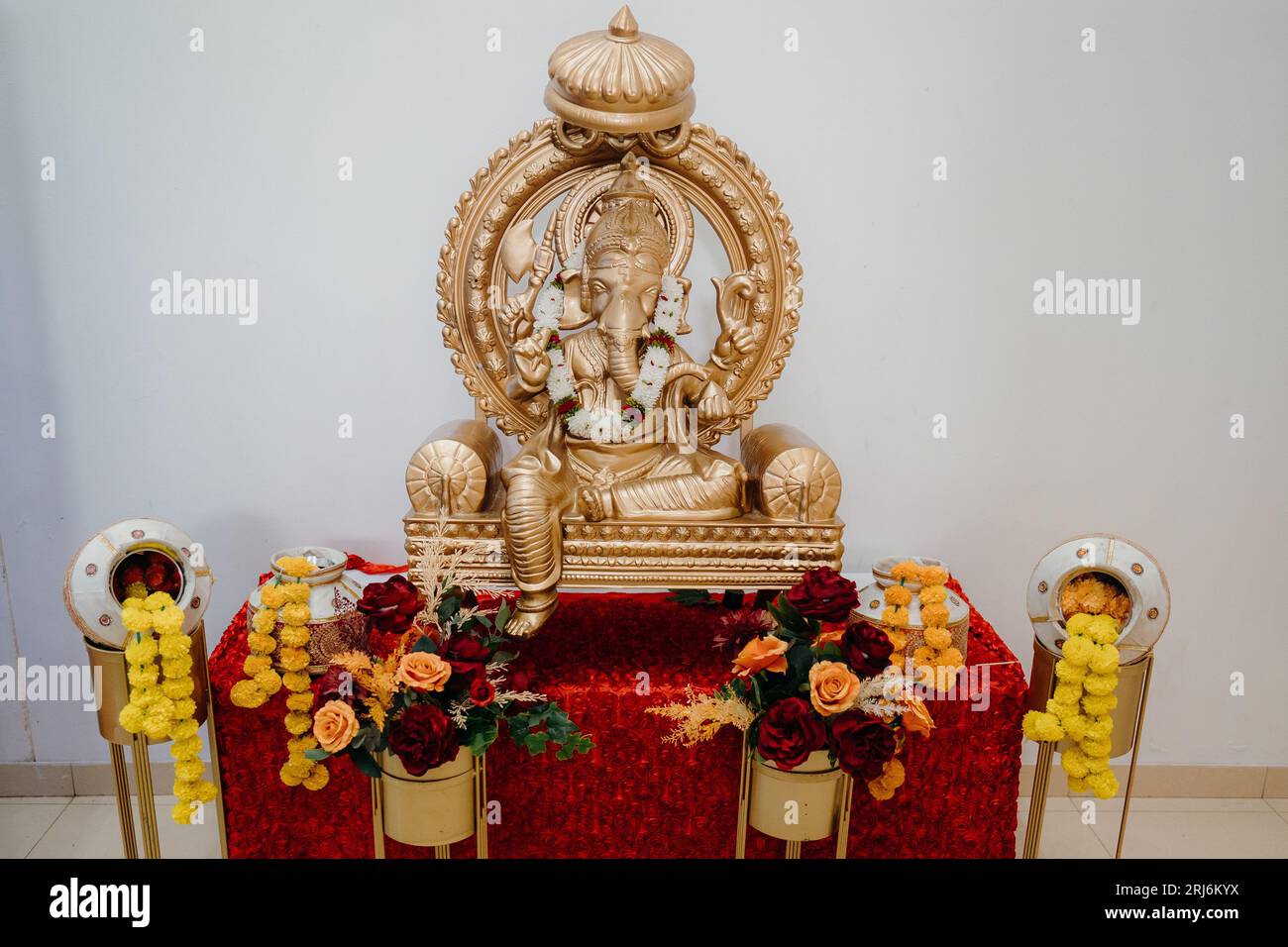 An ornate gold statue of an elephant, a traditional symbol of good luck ...