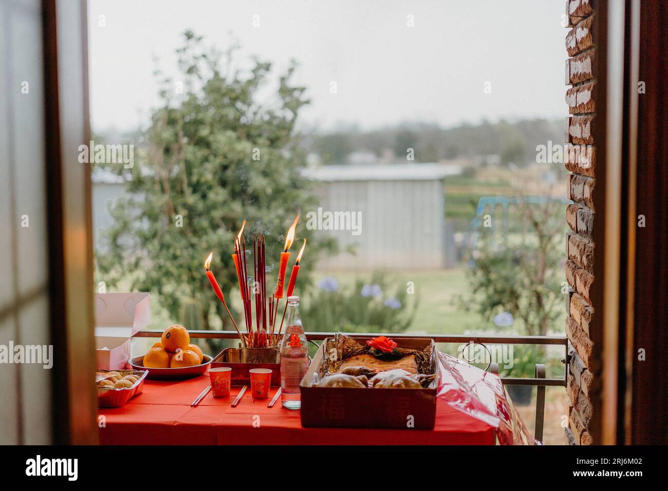 A Chinese wedding tea ceremony featuring an incense burner, symbolizing ...