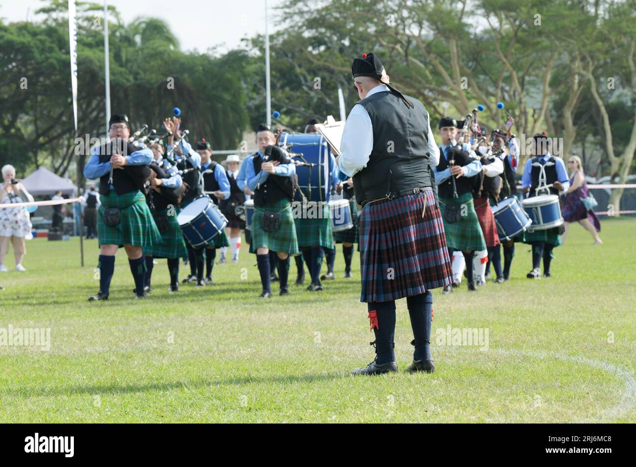 Rear view adult male judging Scottish music competition, 60th Annual ...