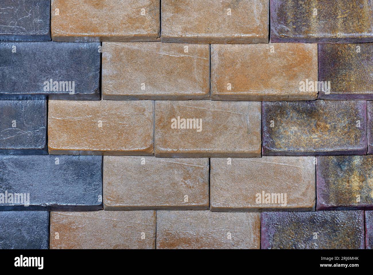 Wall surface with rectangular brick blocks with different colors and ...