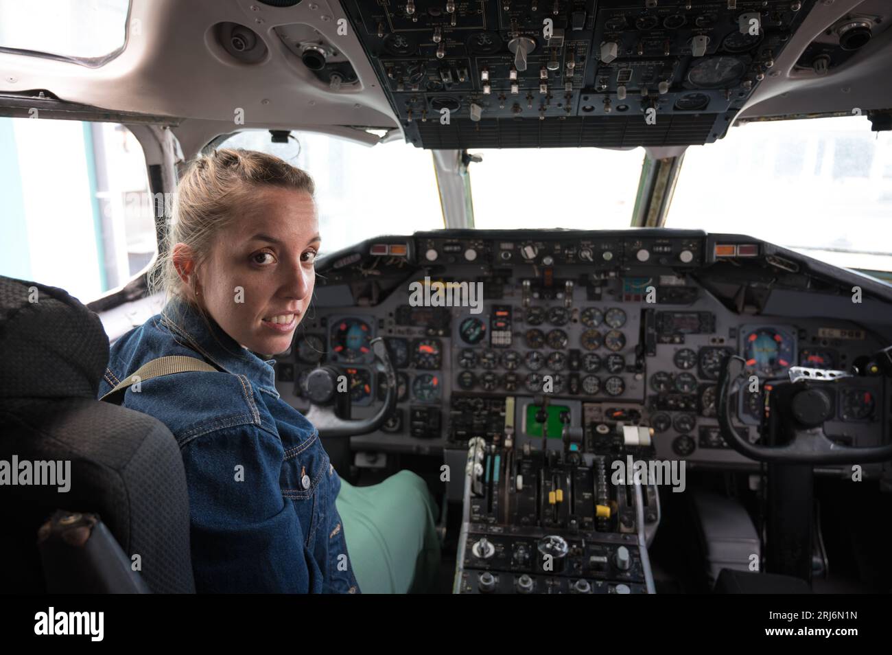 Young girl at the controls of a large commercial airplane Stock Photo ...