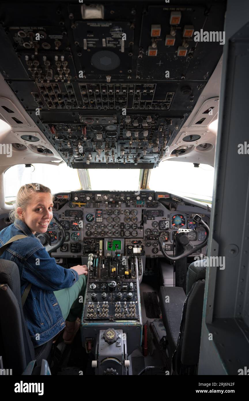 Young girl at the controls of a large commercial airplane Stock Photo ...