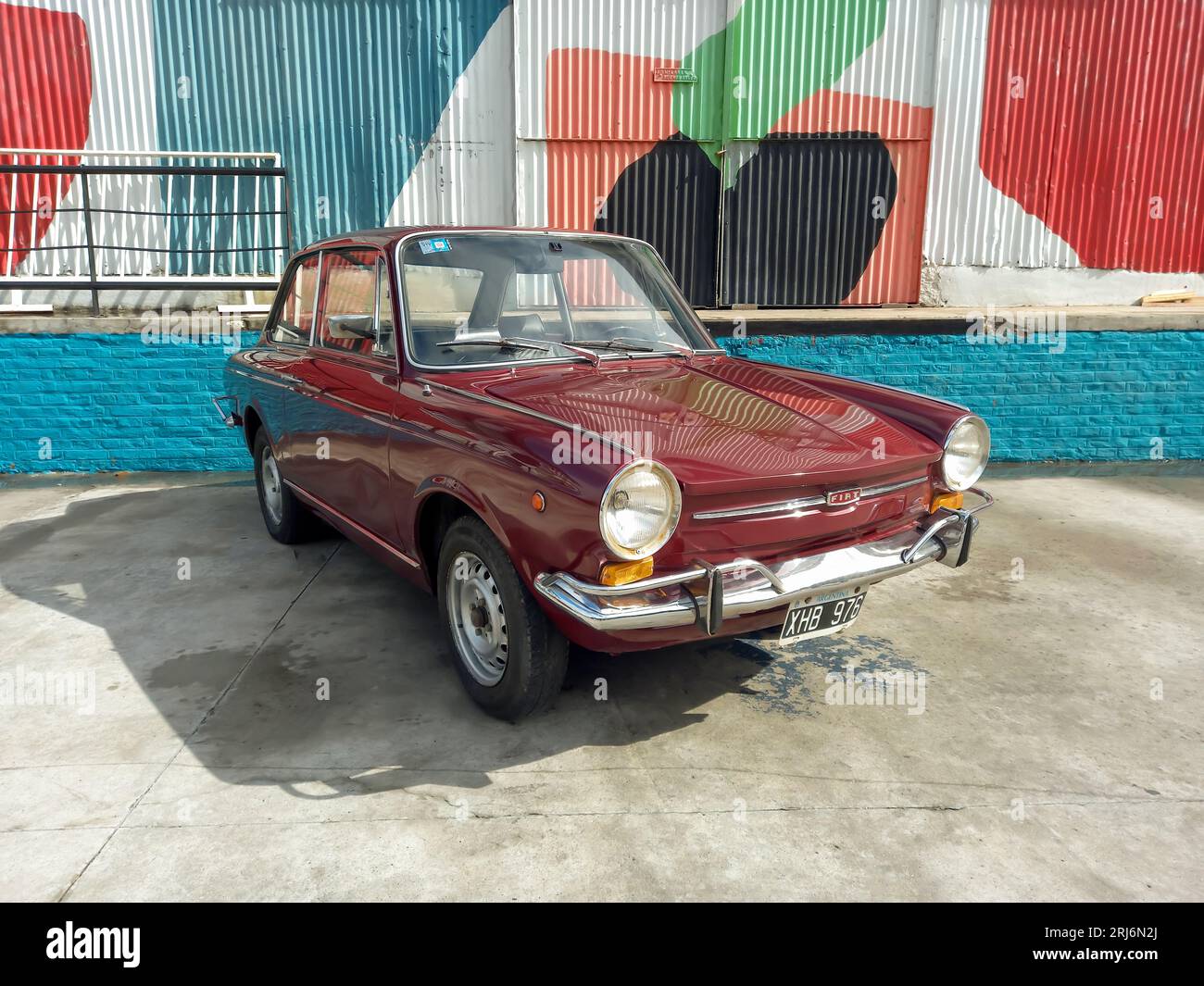 old red burgundy 1960s Fiat 800 coupe built in Argentina. Colorful ...