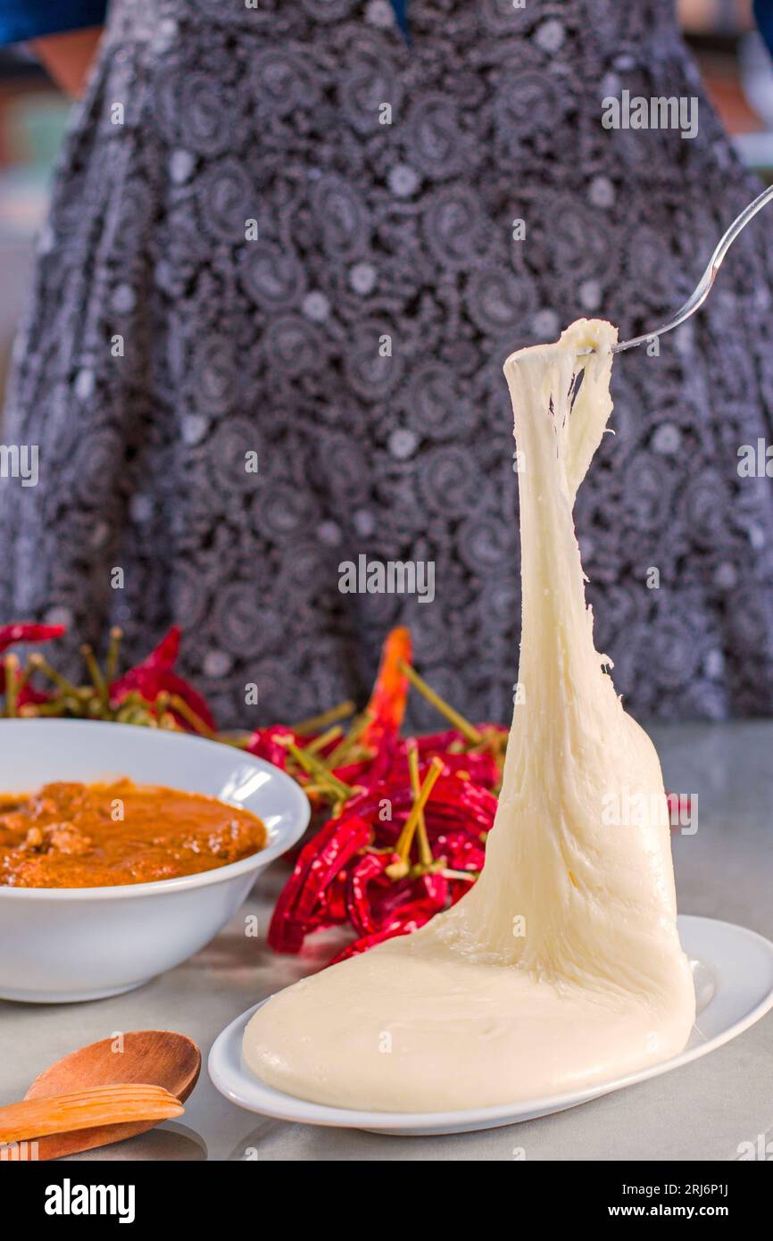 An outdoor table is adorned with a variety of food items with ...