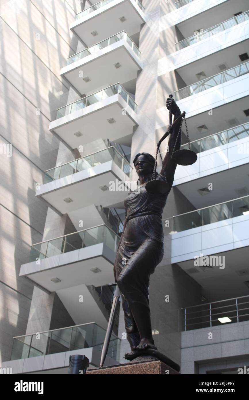 Statue of a female judge representing justice and law inside the ...