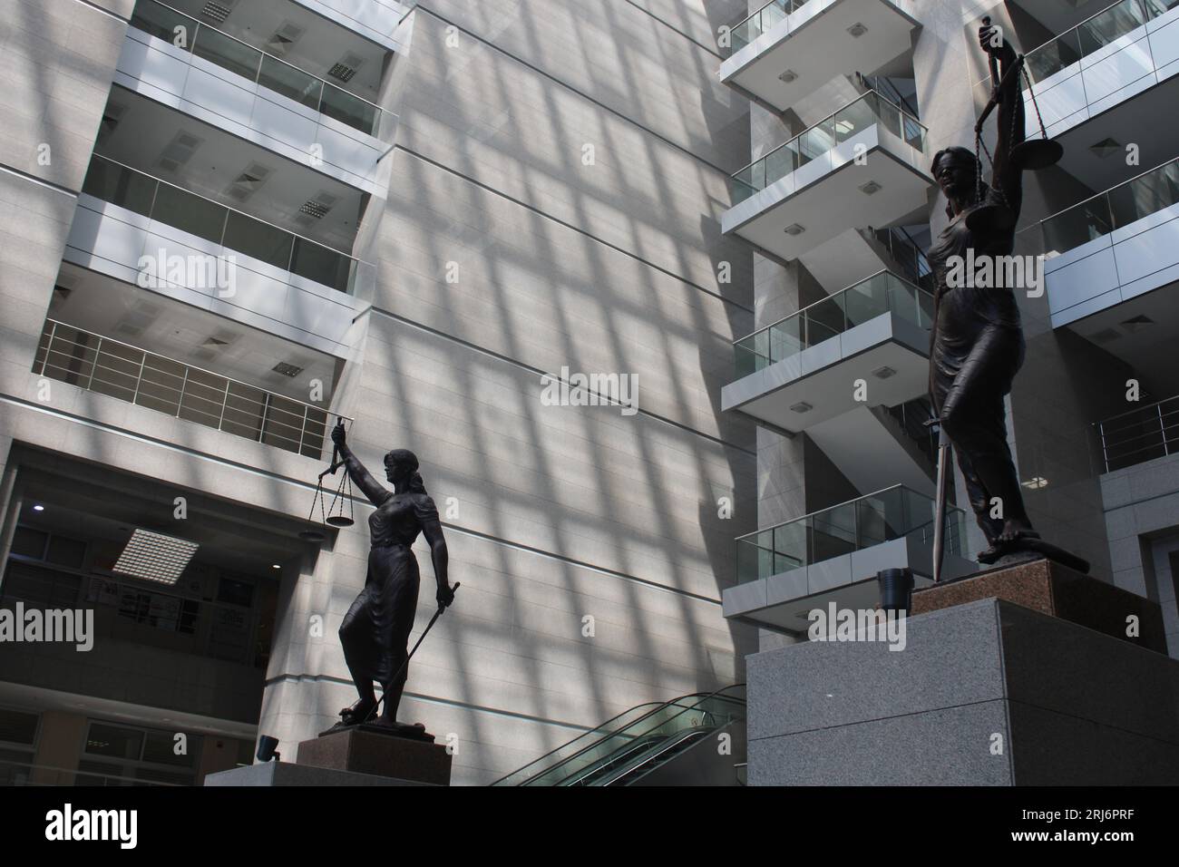 Statue of a female judge representing justice and law inside the ...