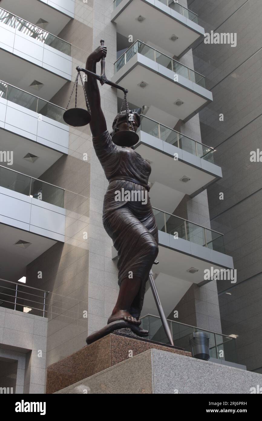 Statue of a female judge representing justice and law inside the ...