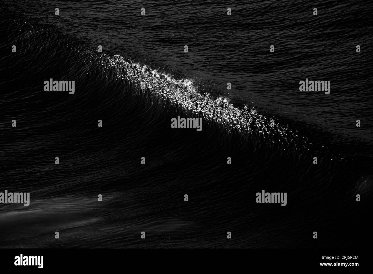 A breathtaking view of a powerful ocean wave in a stunning monochrome ...