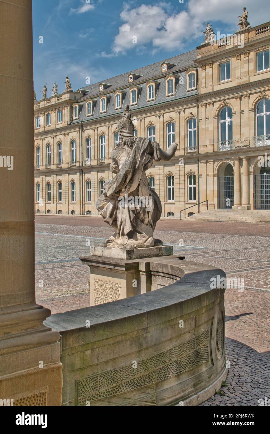 A vertical image of a majestic stone statue standing in the public ...