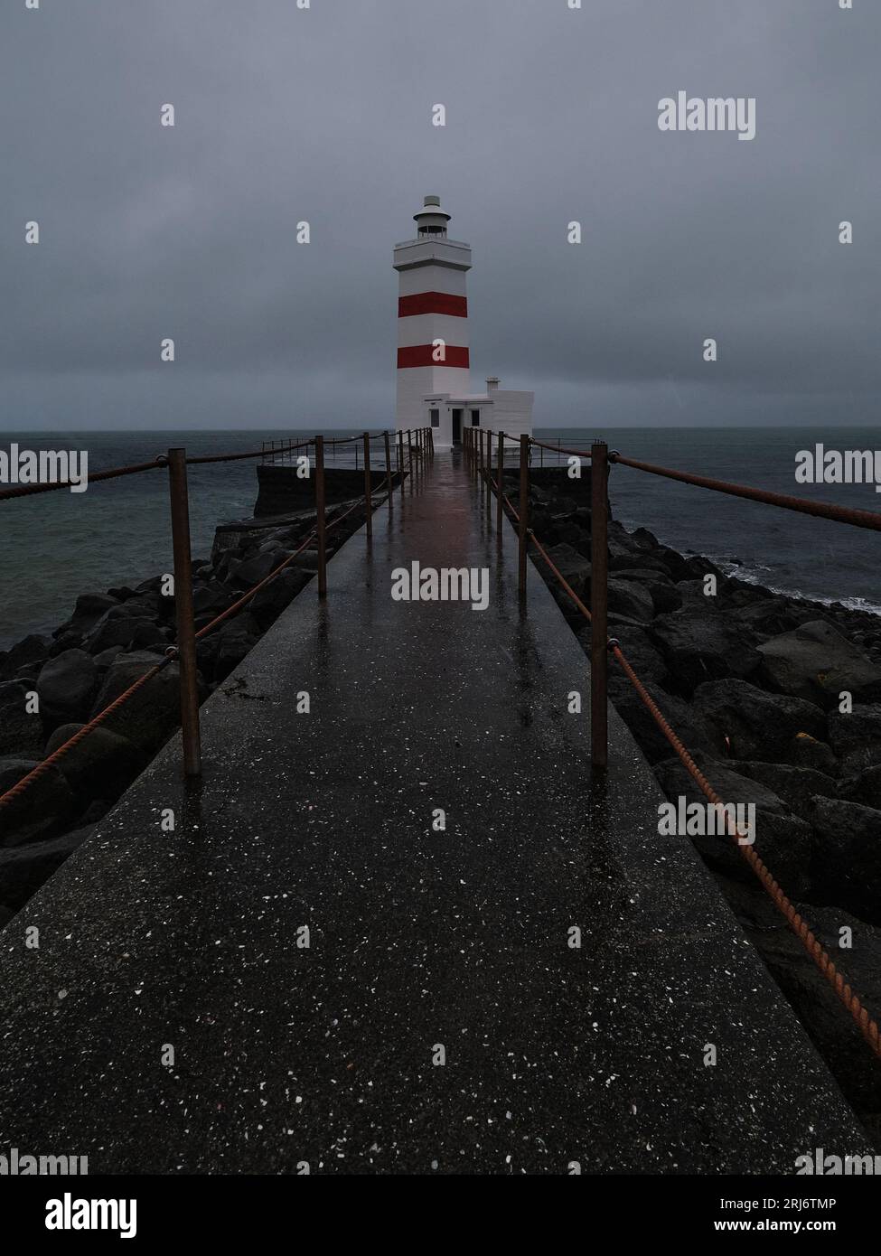 A pathway to the lighthouse located in a misty environment, overlooking ...