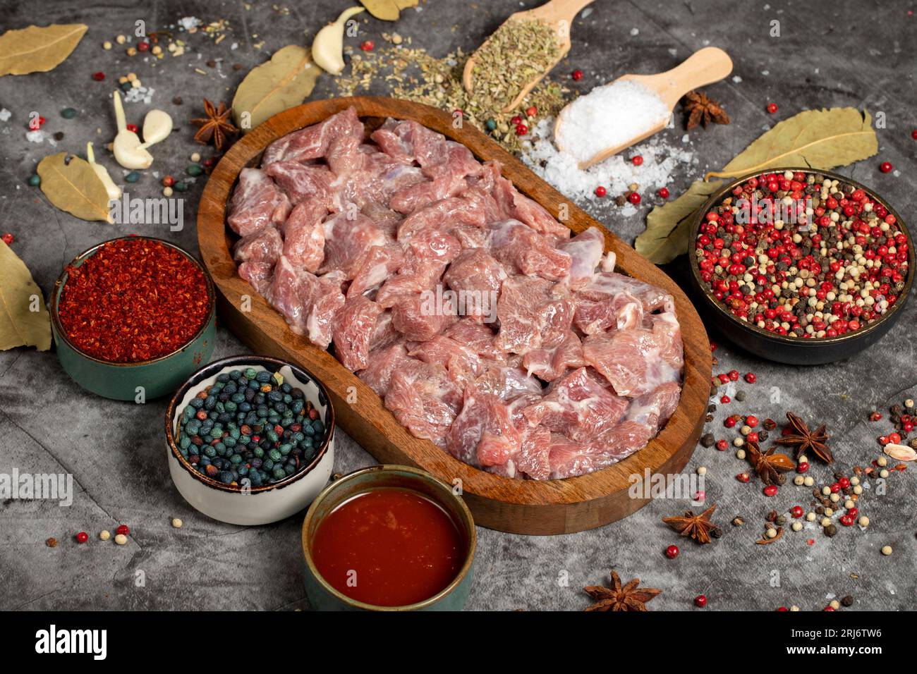 Beef cubed. Fresh raw beef diced meat on dark background. Butcher ...
